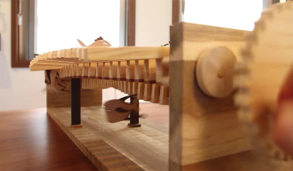Kinetic wooden wave sculpture with a little boat and jumping fish | The ...